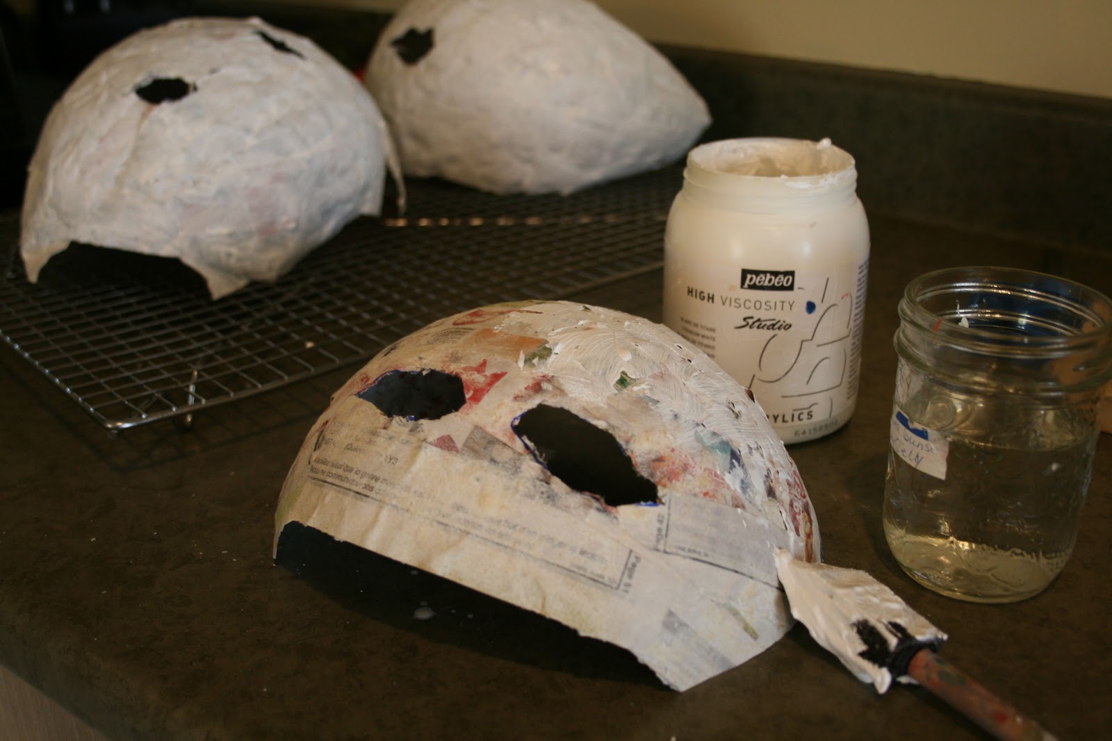 Experience the Wonderful.: paper mache masks.