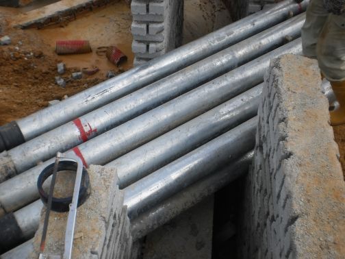 Electrical Installations: Cable duct crossing roadside drain