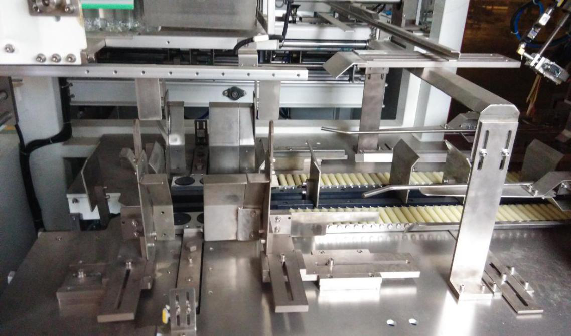 henopac: Fully automatic wrap around case packer