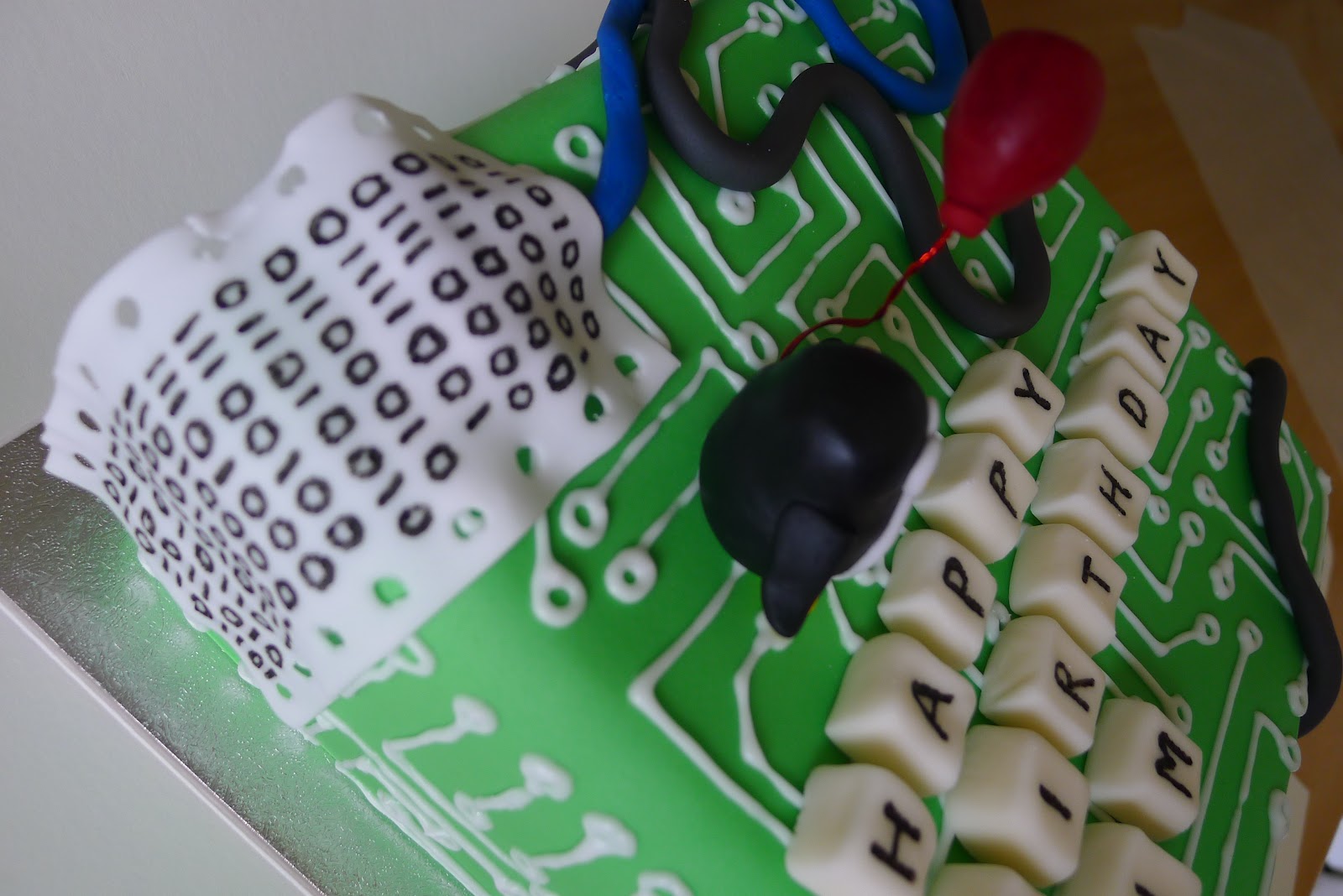 hello. is it tea you're looking for?: computer inside birthday cake
