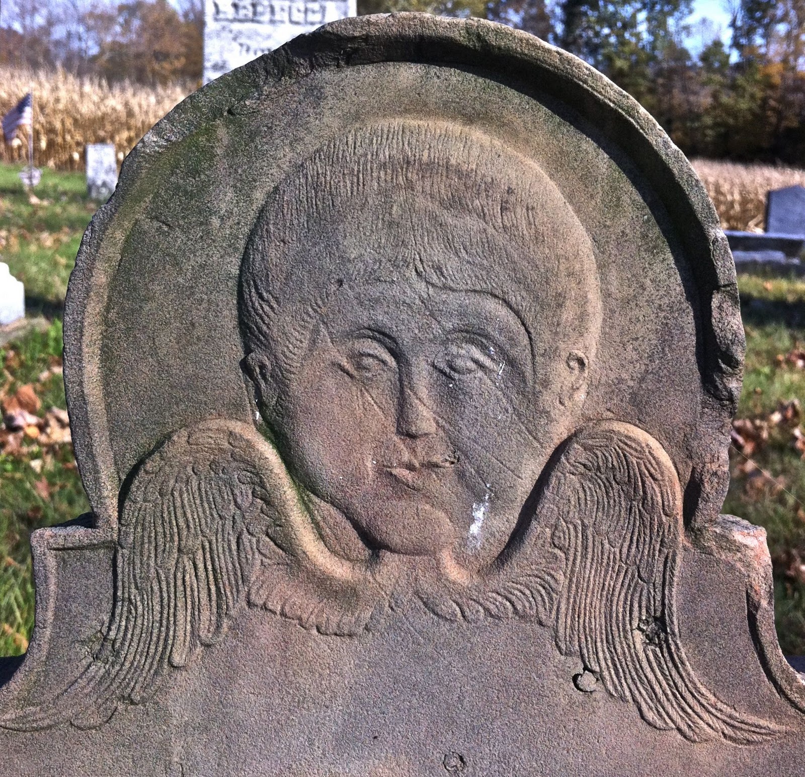 Gravestoned: Winged face