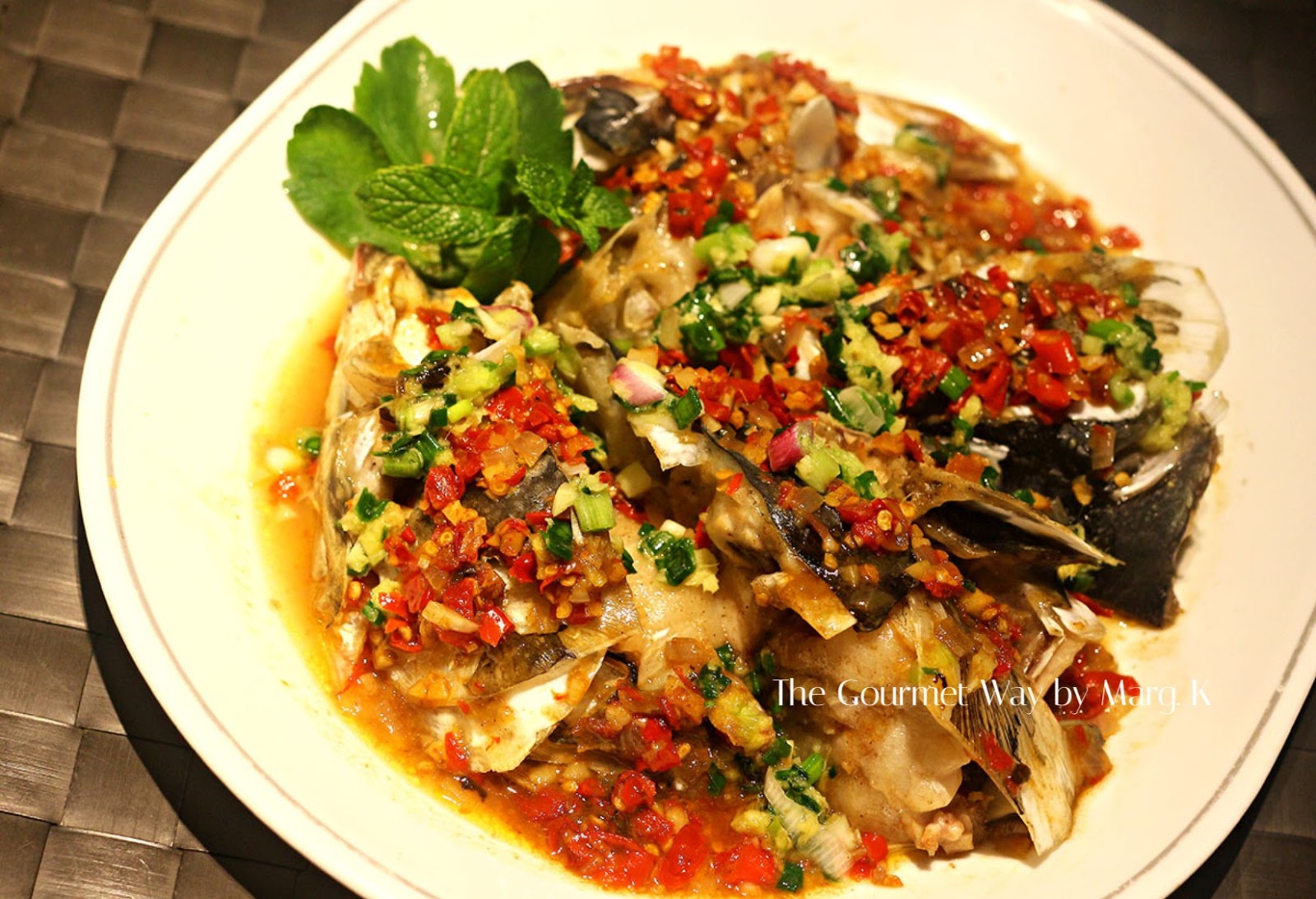 Steamed Fish Head with Homemade Chopped Chili Pepper Sauce . 自家剁椒蒸魚頭