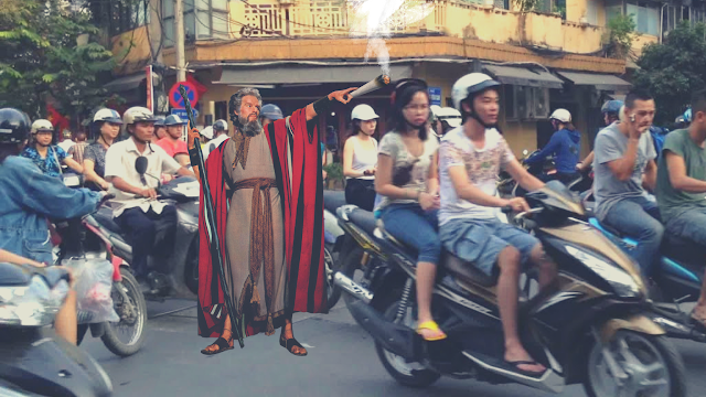 Modern-day Moses parts sea of motorbikes - The Durian - Hanoi's ...