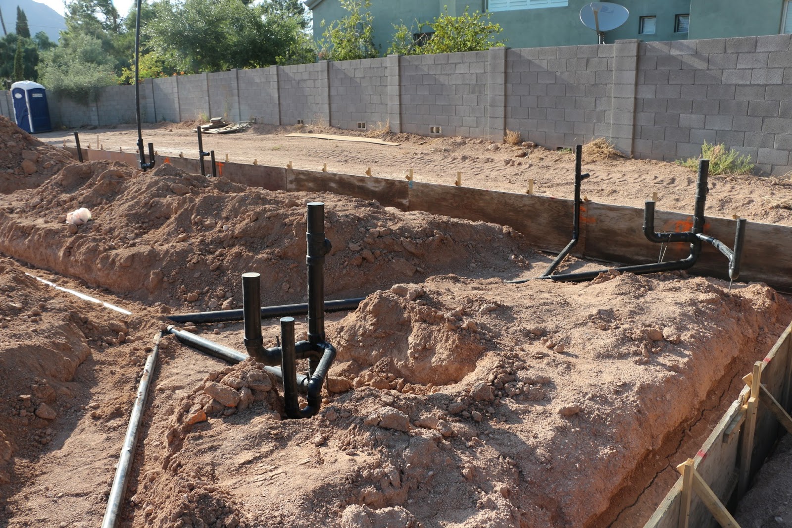 Dusty Coyote: Finished Grading, Footings, Plumbing, and Water