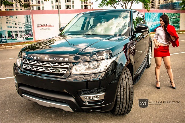 Rebellion office girl poses with Range Rover Sport | Carsfresh
