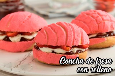 Concha rellena de nata y fresa