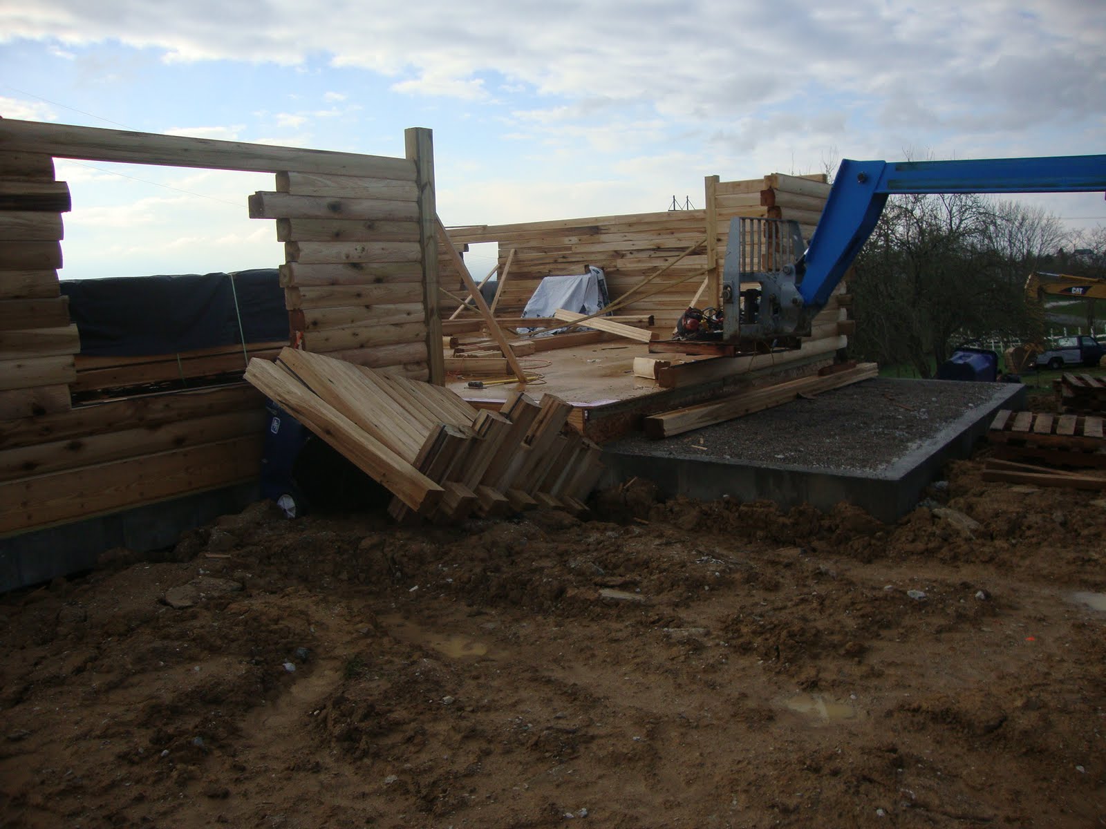 Grizzly Log Homes: Tulip poplar log stack in Kn April