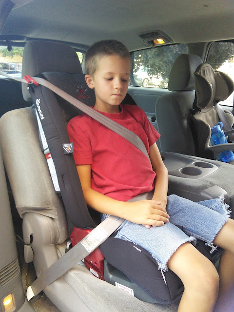 Keep your older children safe in the car by using a booster seat.