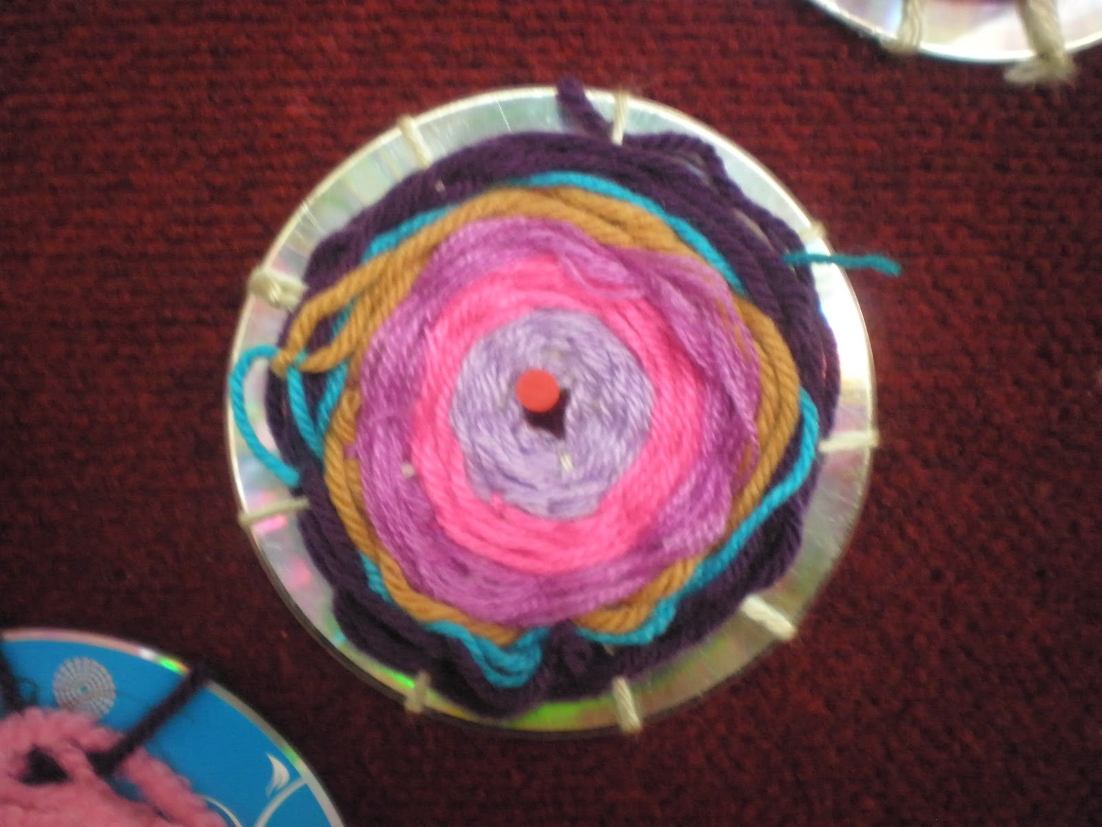 Colouring outside the lines (inside Ms D's artroom): CD weaving
