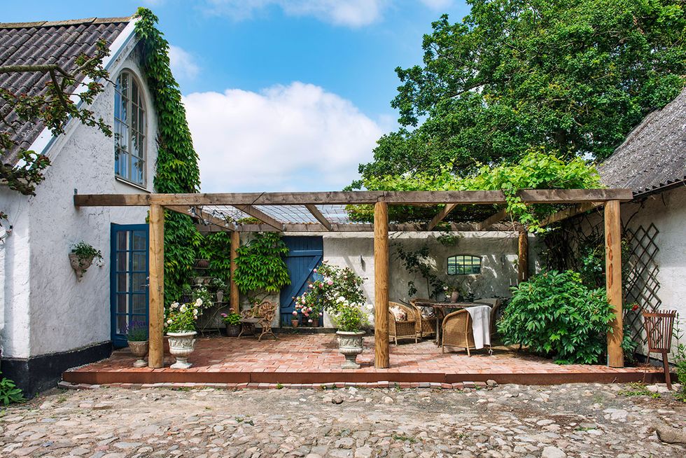 Rural decor and French influences at an artist's home in Österlen, Sweden