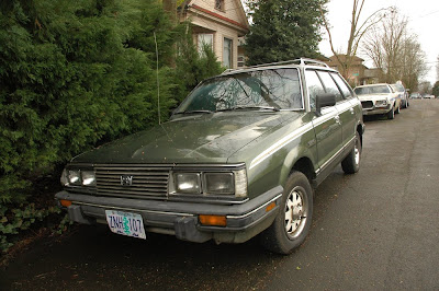 OLD PARKED CARS.: 1983 Subaru GL Station Wagon.