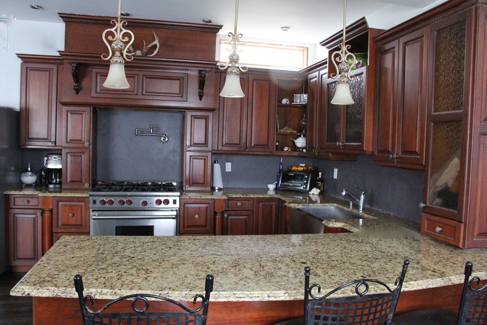 Sheer Serendipity: Charcoal black plaster backsplash