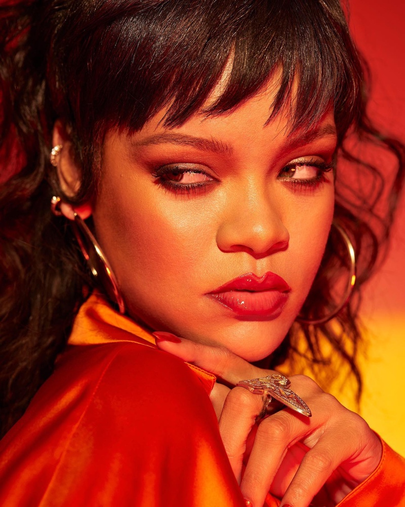 Rihanna poses for Fenty Beauty's Gloss Bomb Heat Campaign