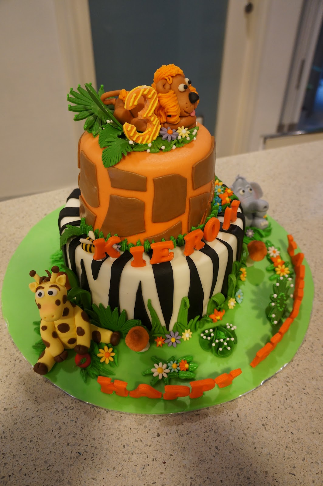 Joyous Cake Company: Jungle theme cake with sugar hand molded animals