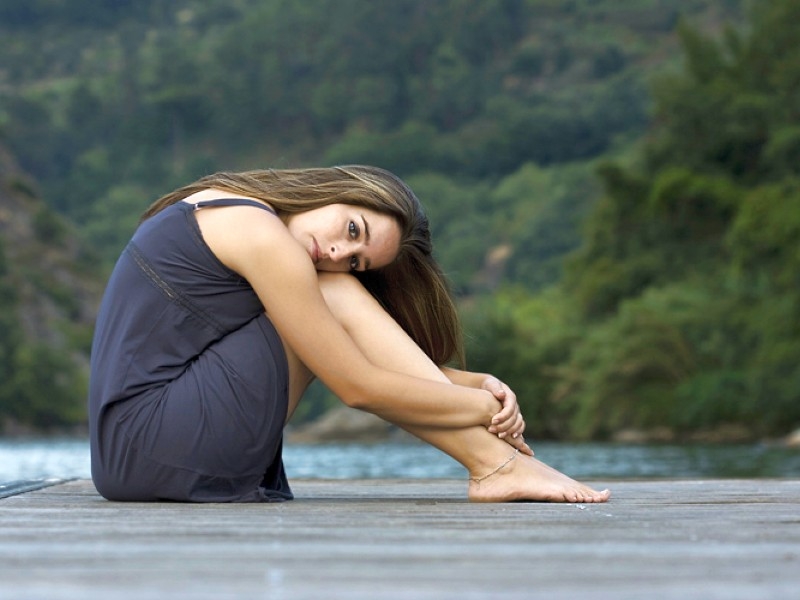 A Sad Girl Sitting Alone Wallpaper