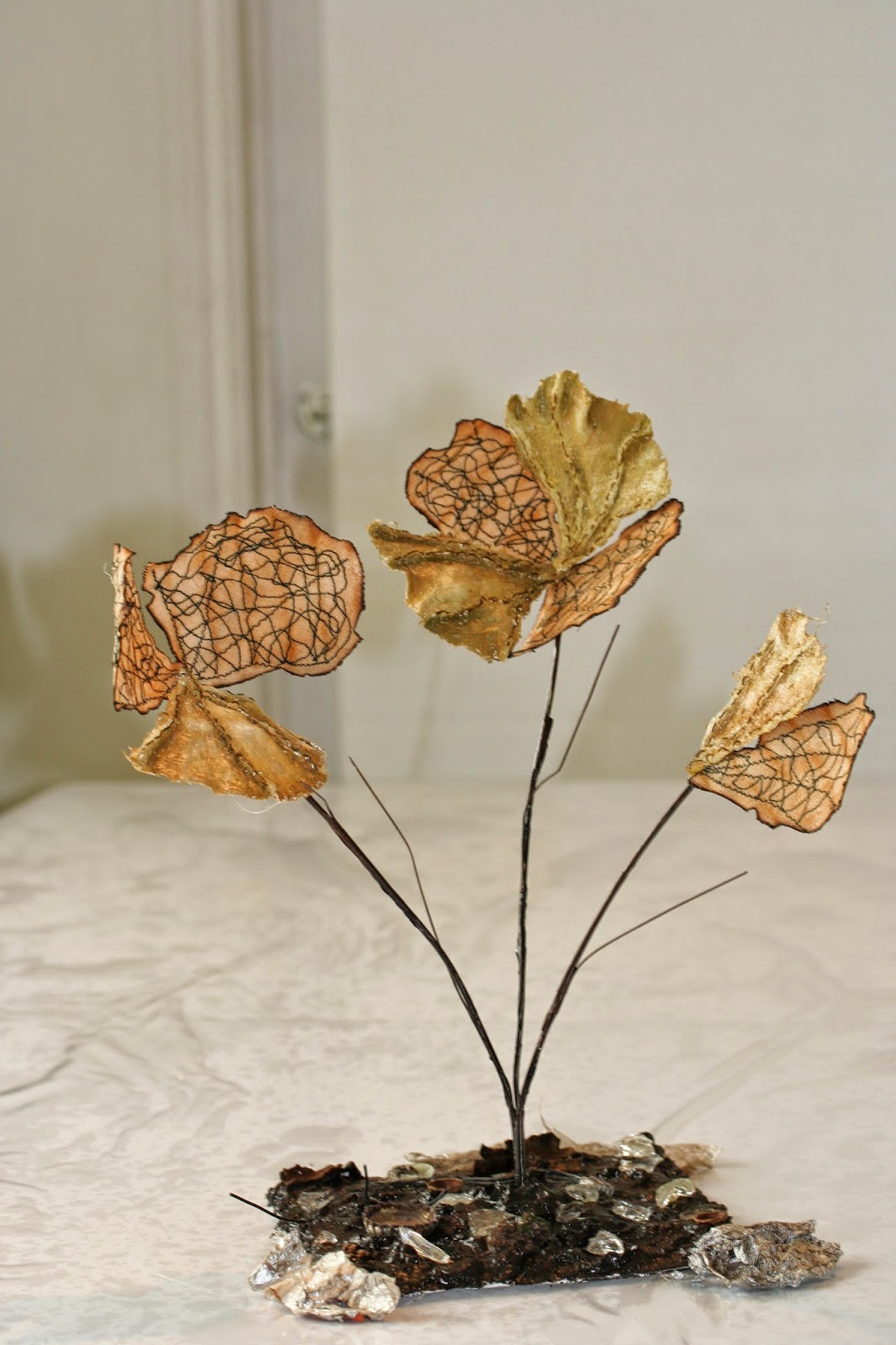 Silver Bells and Cockle Shells: Modroc sculpture of dying flower