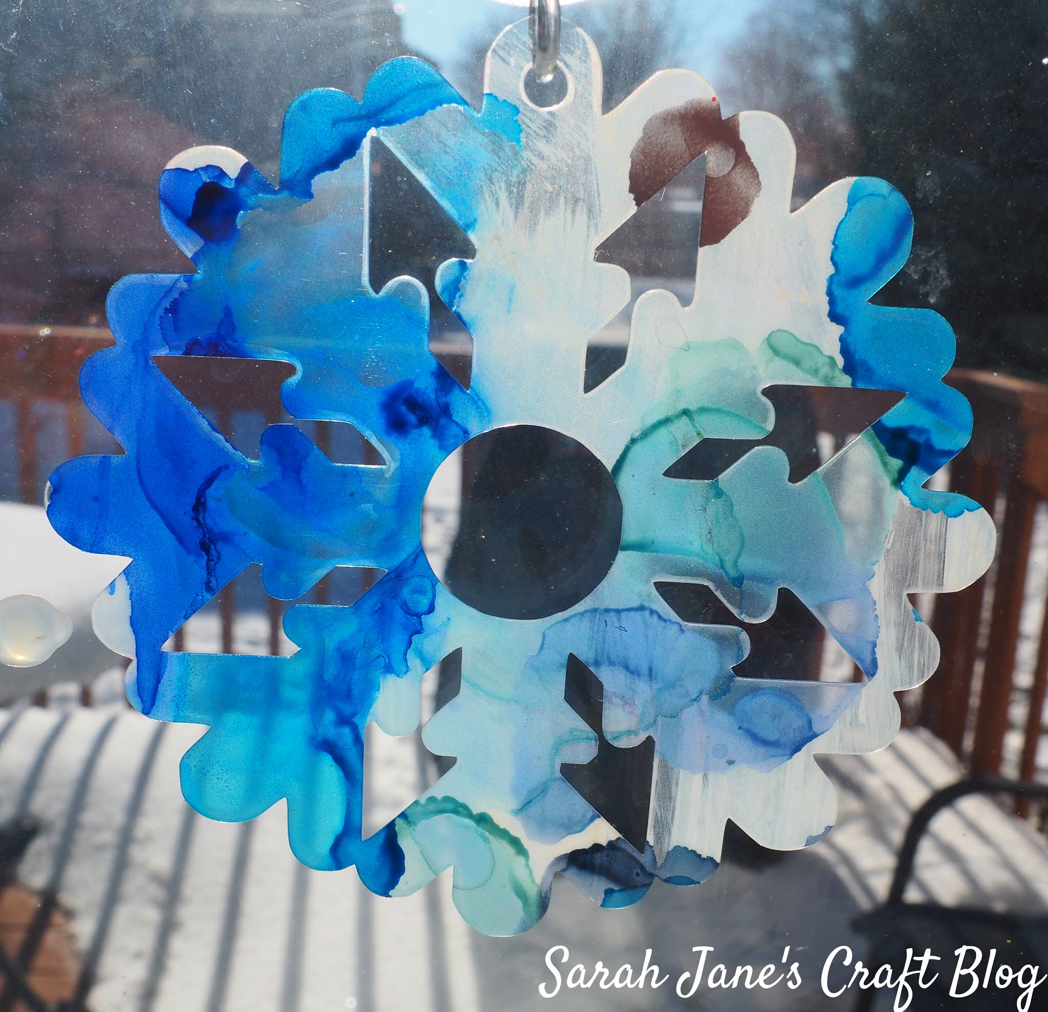 Snowflake Suncatchers from Alcohol Ink on Laminating Pouches