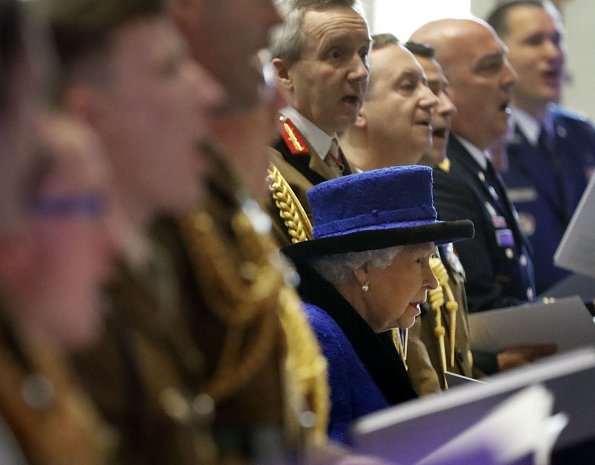 Queen Elizabeth attends a service at the Guards Chapel in London