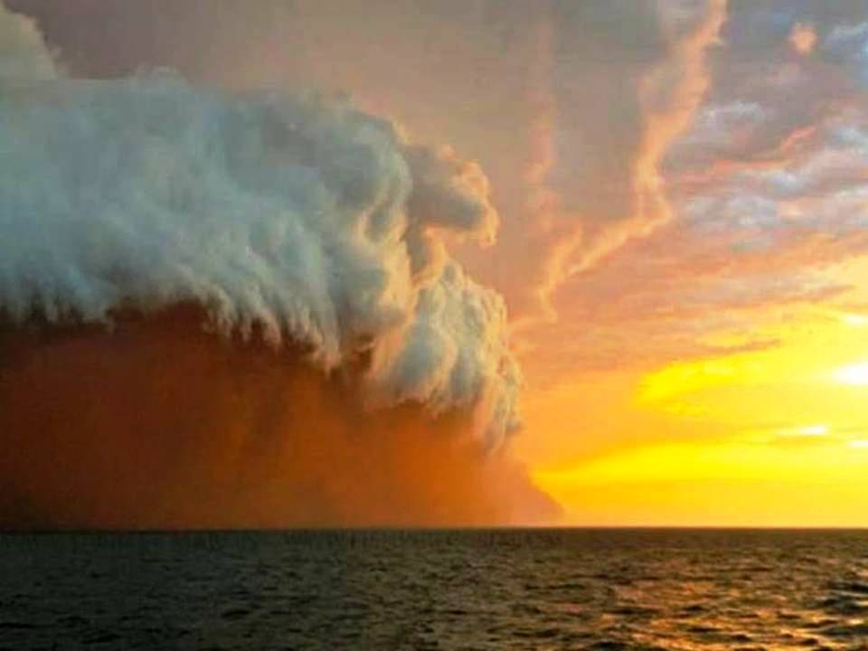 Incredible Tsunami-like wave of red dust whipped up by cyclone over ...