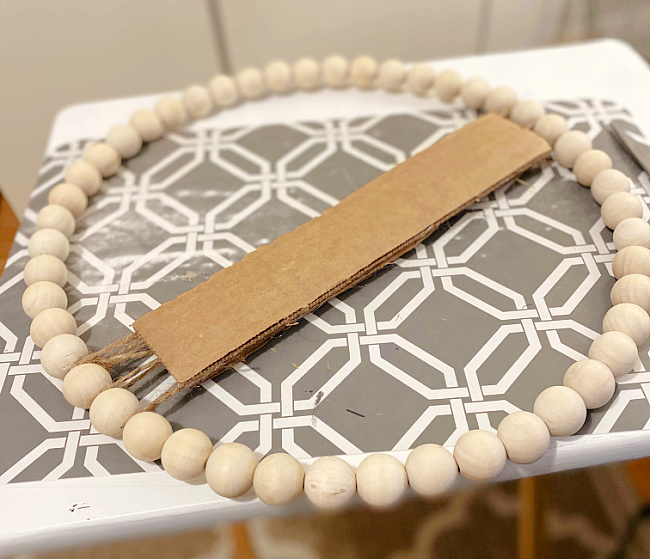 Beaded Wreath with Painted Banner