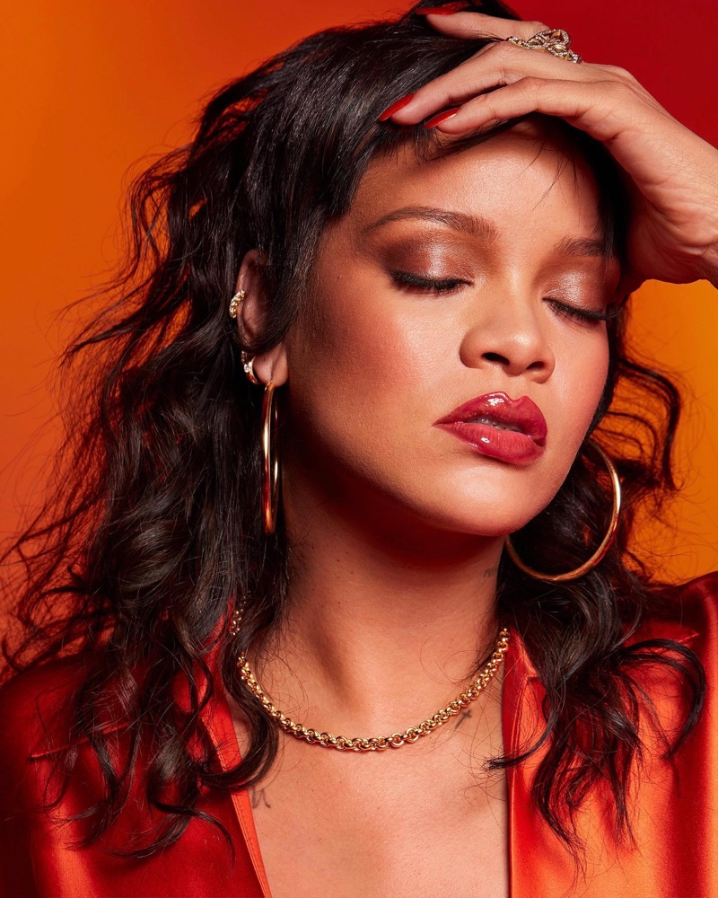Rihanna poses for Fenty Beauty's Gloss Bomb Heat Campaign