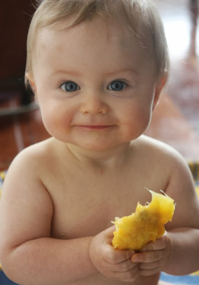 Kids baby pictures: Baby Tasting Mango