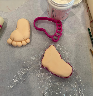 The Bake More: Easy Baby Bottom Cake - Feet made with cookie cutters