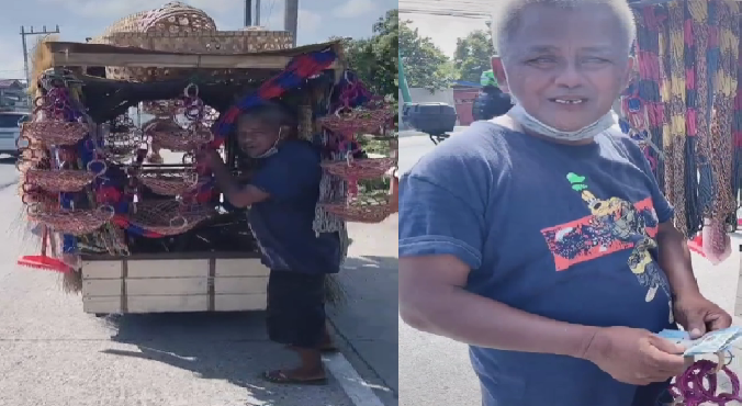 Isang matanda mano-manong itinutulak ang kariton ng panindang wood ...