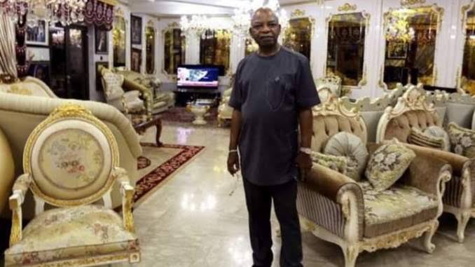 Arthur Eze poses inside his mansion Sitting Room