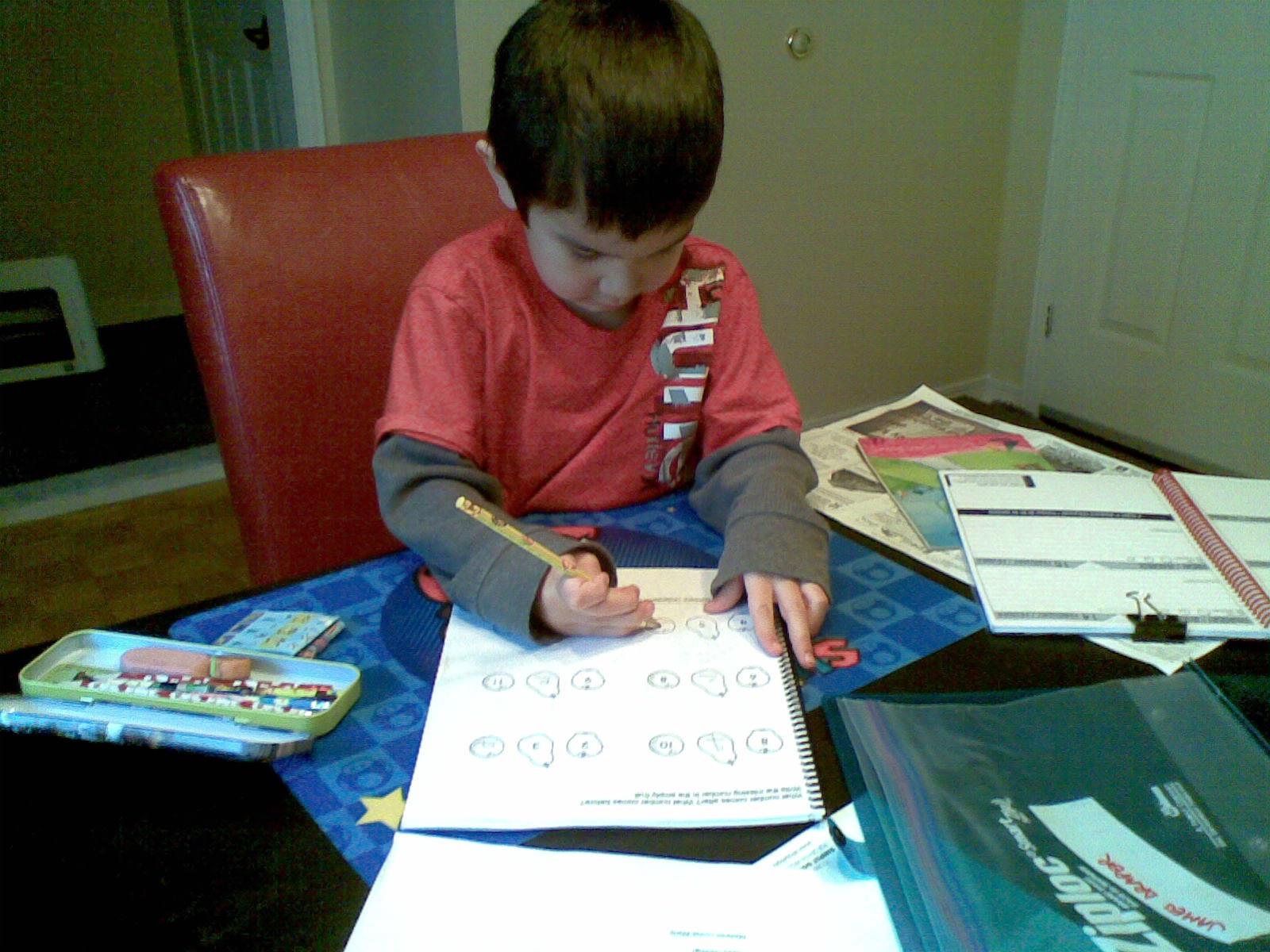 Photo and Video Album: James' first real homework from school