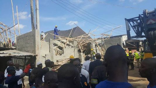 Photos: Many trapped as three-storey building under construction ...