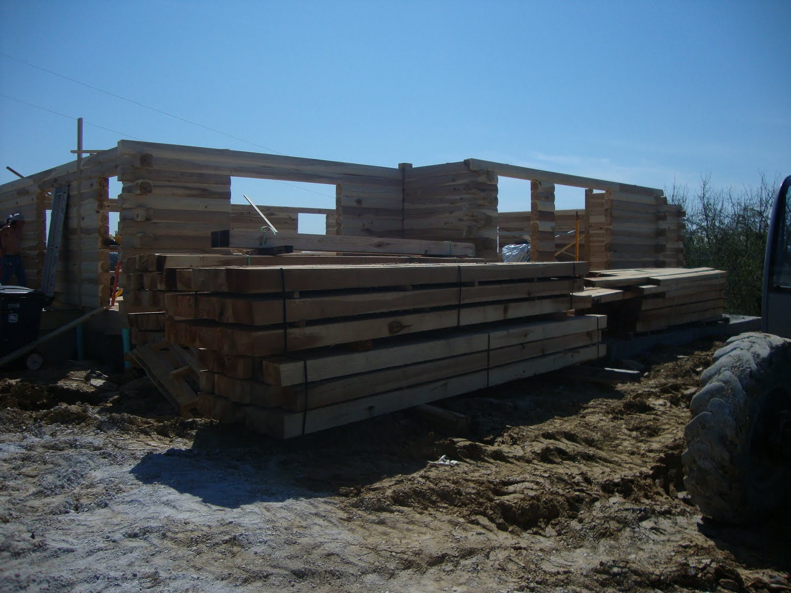 Grizzly Log Homes: Tulip poplar log stack in Kn April