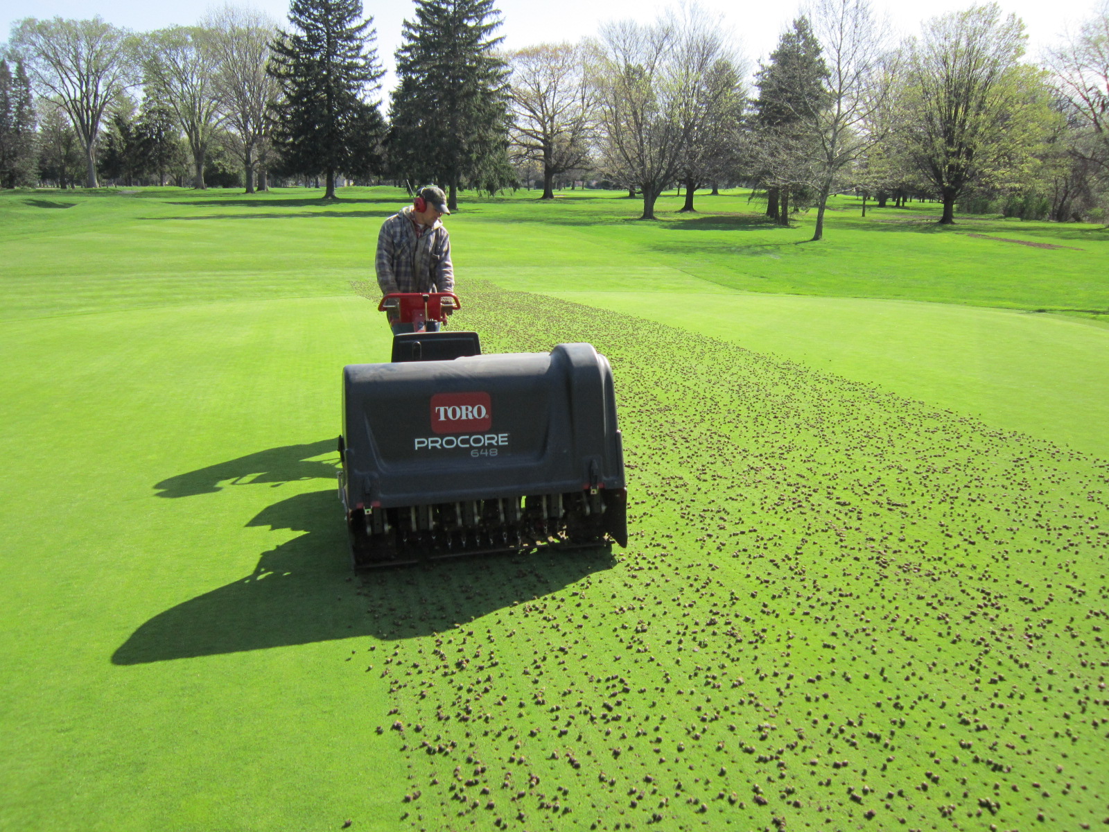 Findlay Country Club Grounds Department: Aerifying greens
