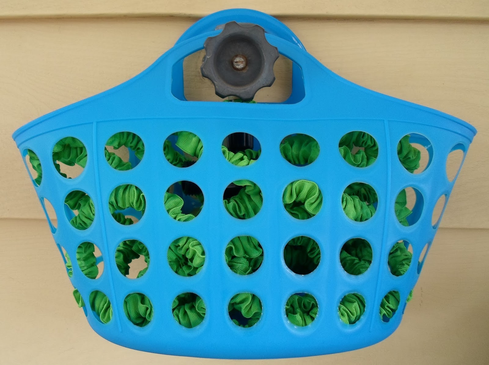 Happier Than A Pig In Mud: $1 Hanging Storage for a Flexible Hose