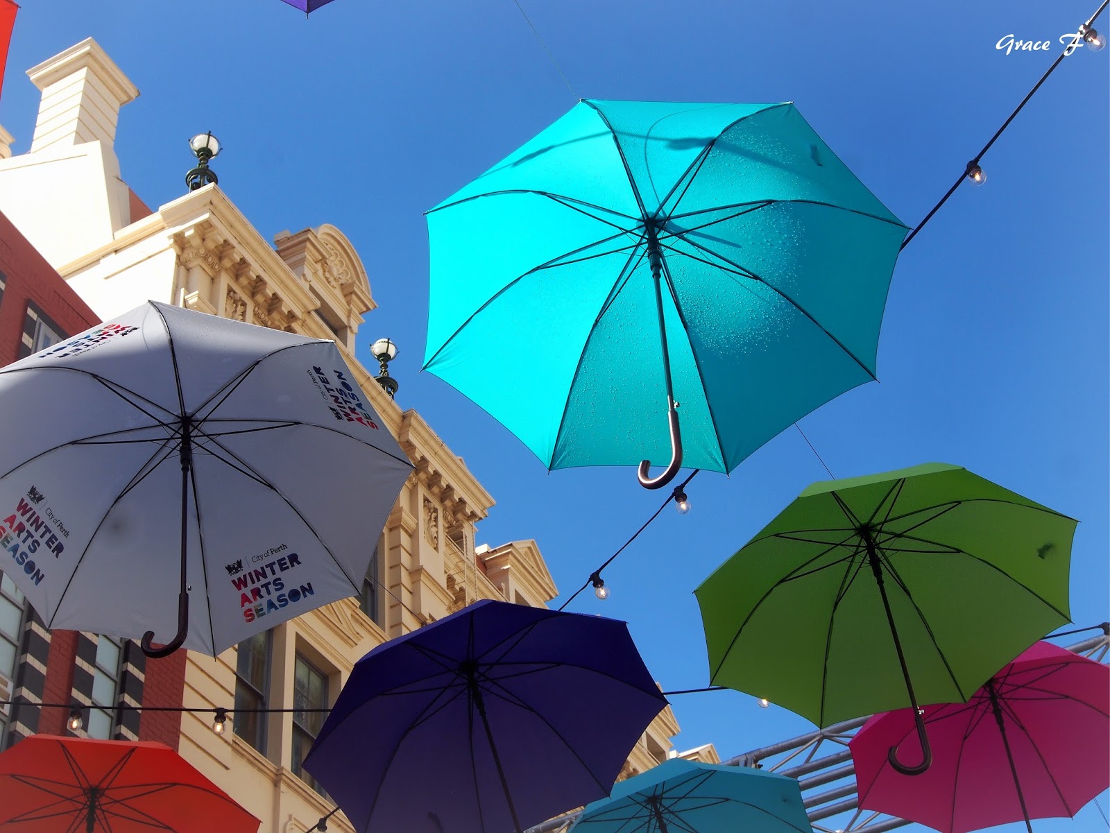 Perth Daily Photo : Umbrellas up, up and almost away!