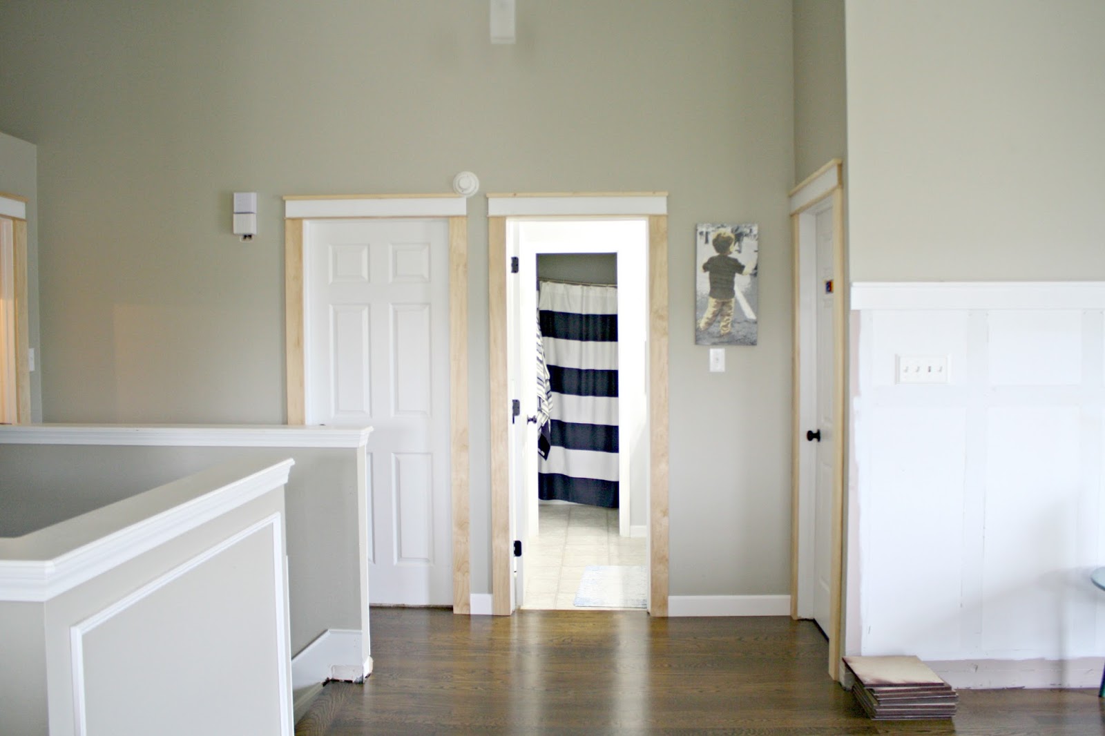 Hardwoods in the loft and adding farmhouse door trim - Zhakila Decorating