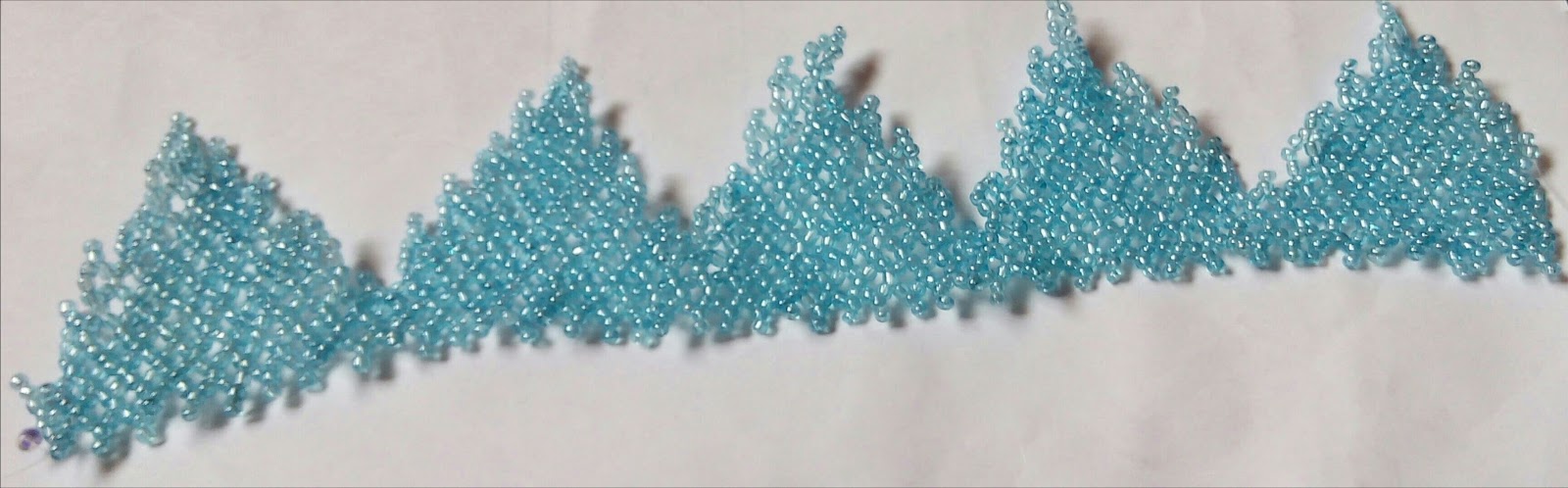 Beadination: Beautiful beaded flower using the bead netting technique.