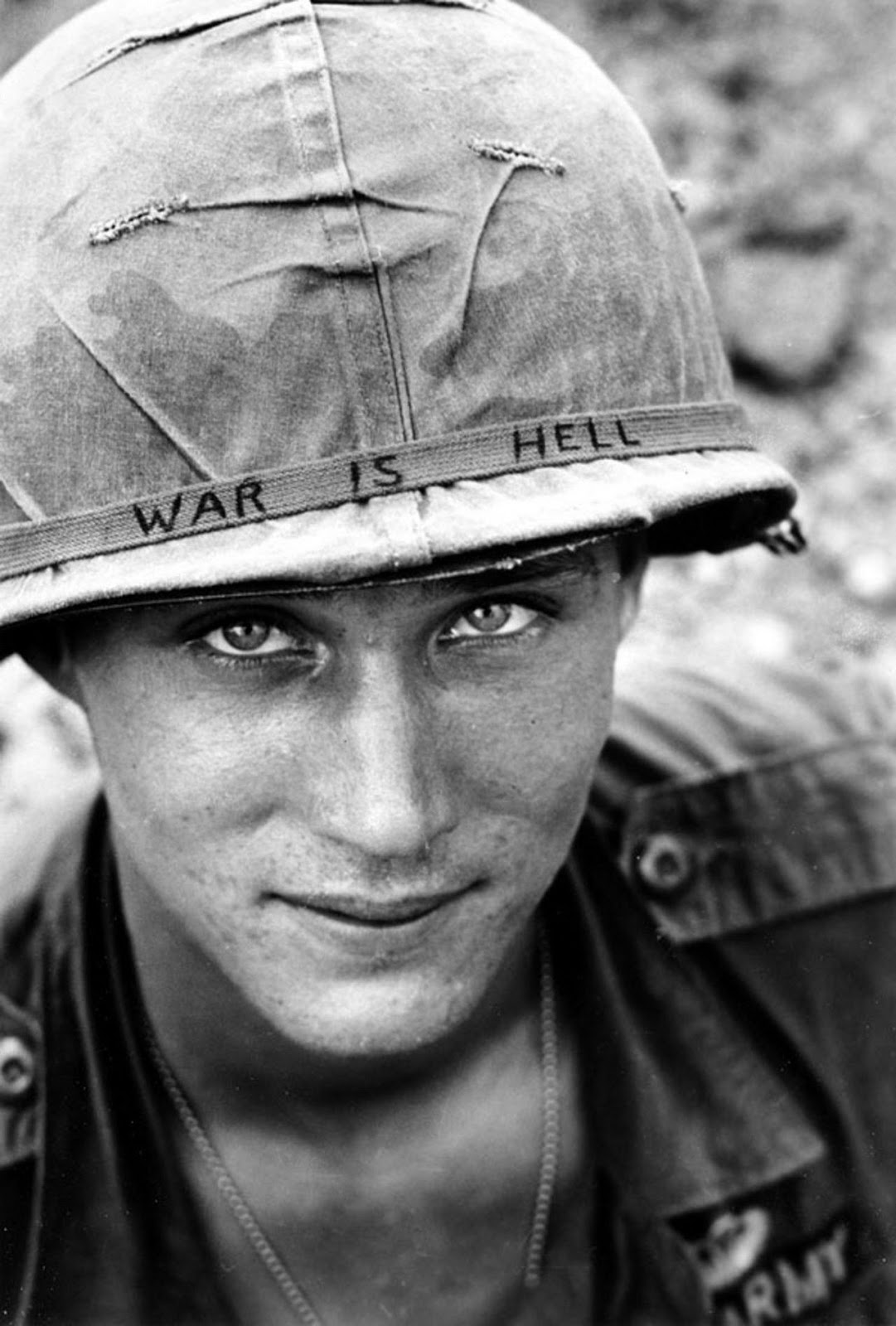 The Story Behind the Iconic Photo of a Soldier Wearing a Hand Lettered “War is Hell” Slogan on ...
