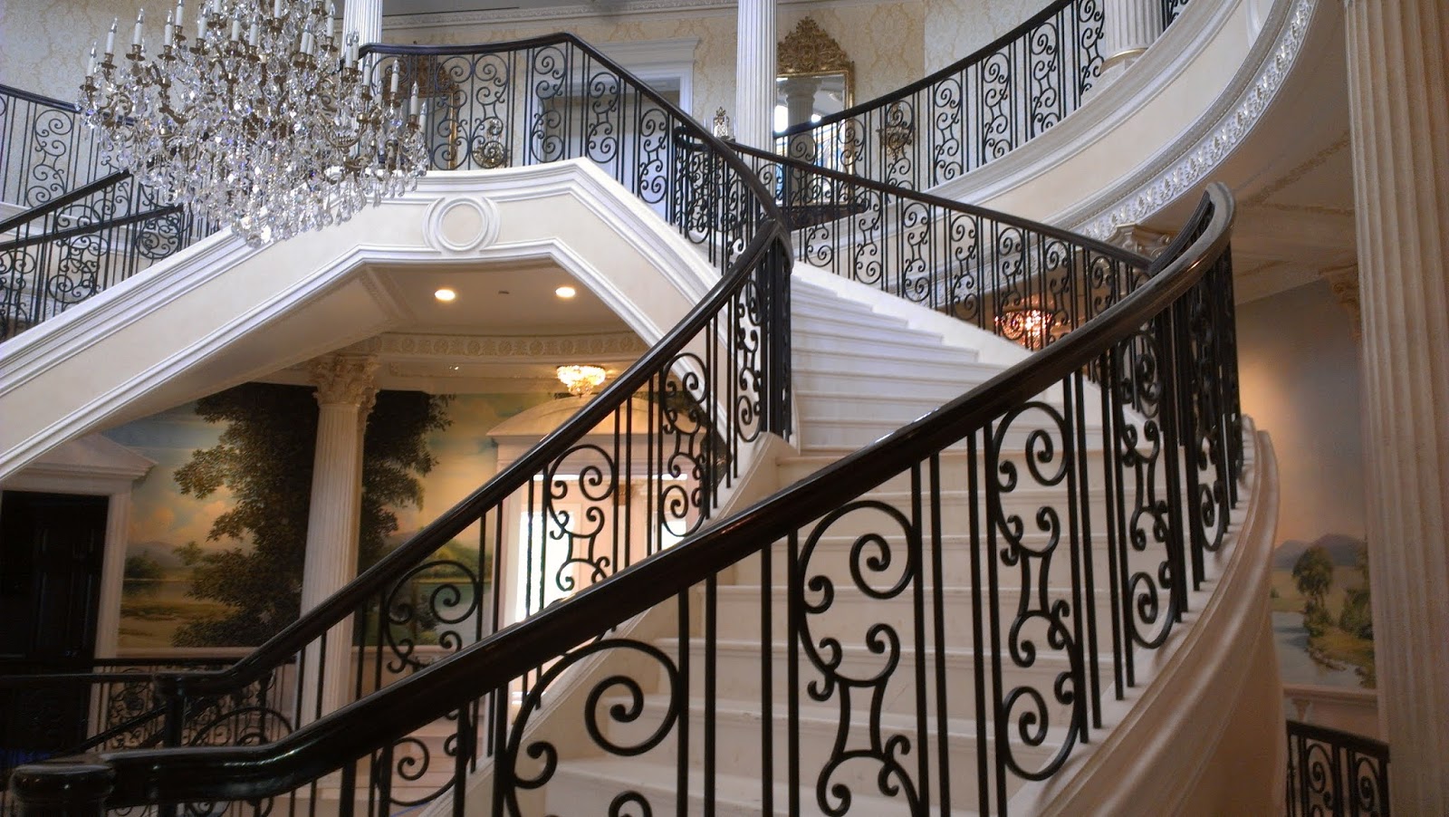 Elegant and Welcoming modern curved staircase in Hamilton