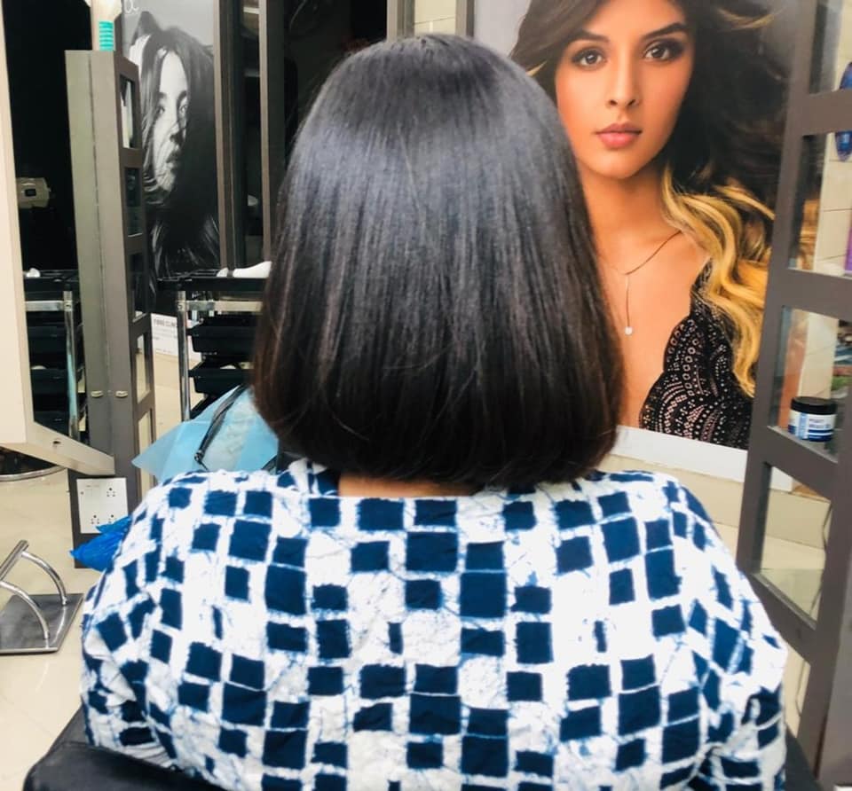 Young women long to nape length bob cut hair cut - Village Barber Stories