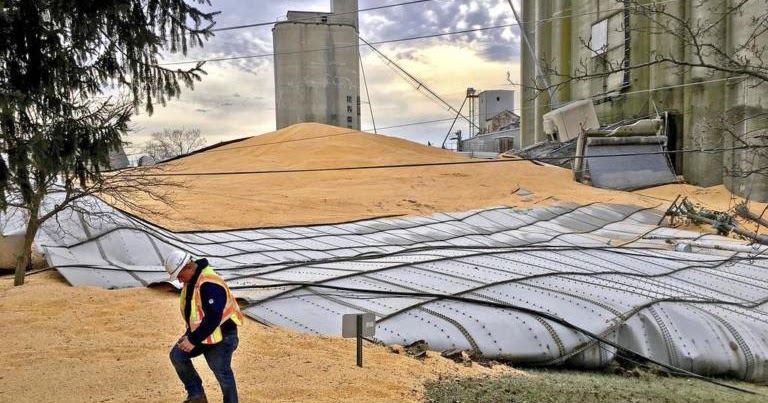 THE WESTERNER: Silo collapse sends about 10,000 tons of corn onto road