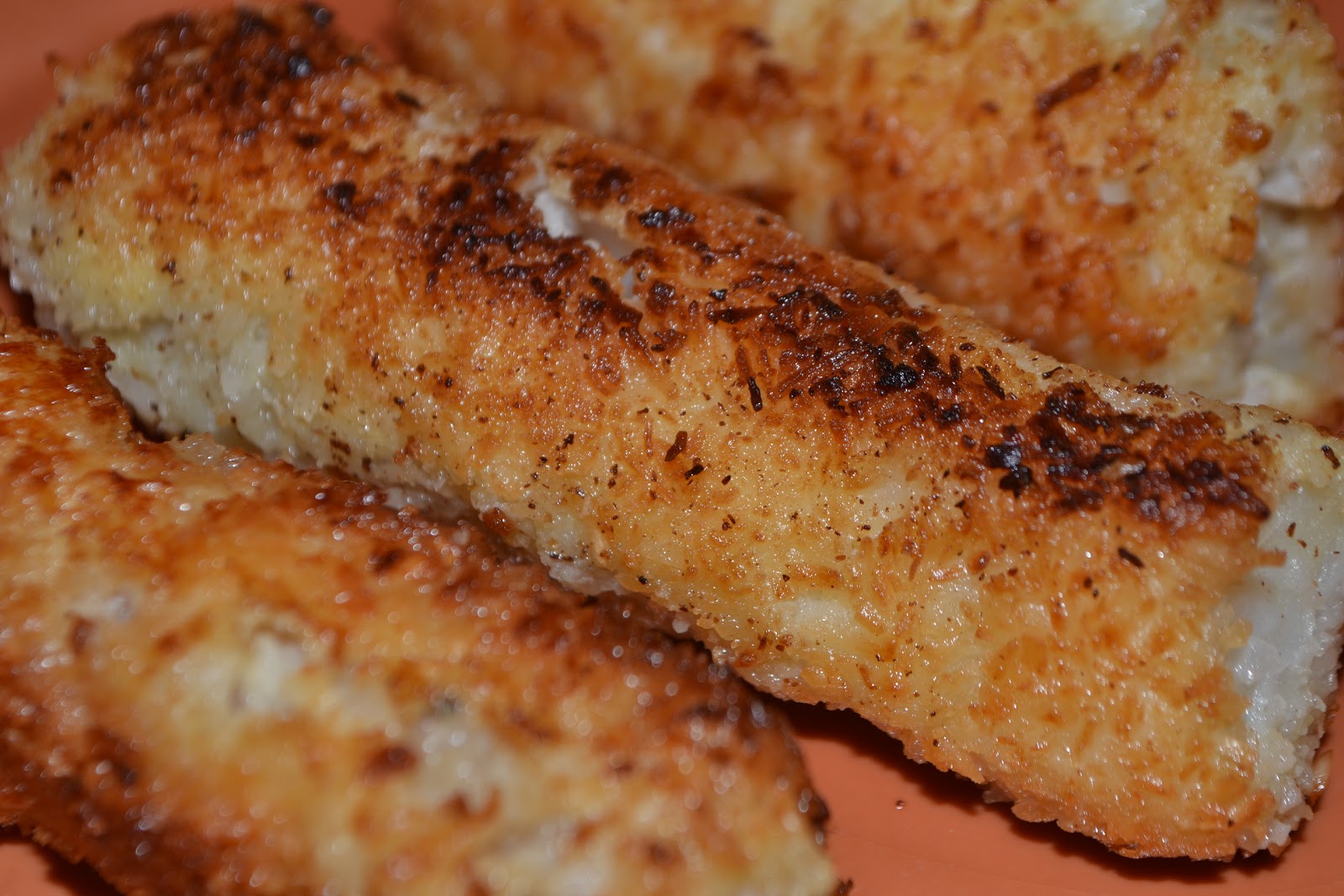 Ryskadockor: Kokospanerade fiskpinnar med limedoftande wok :)