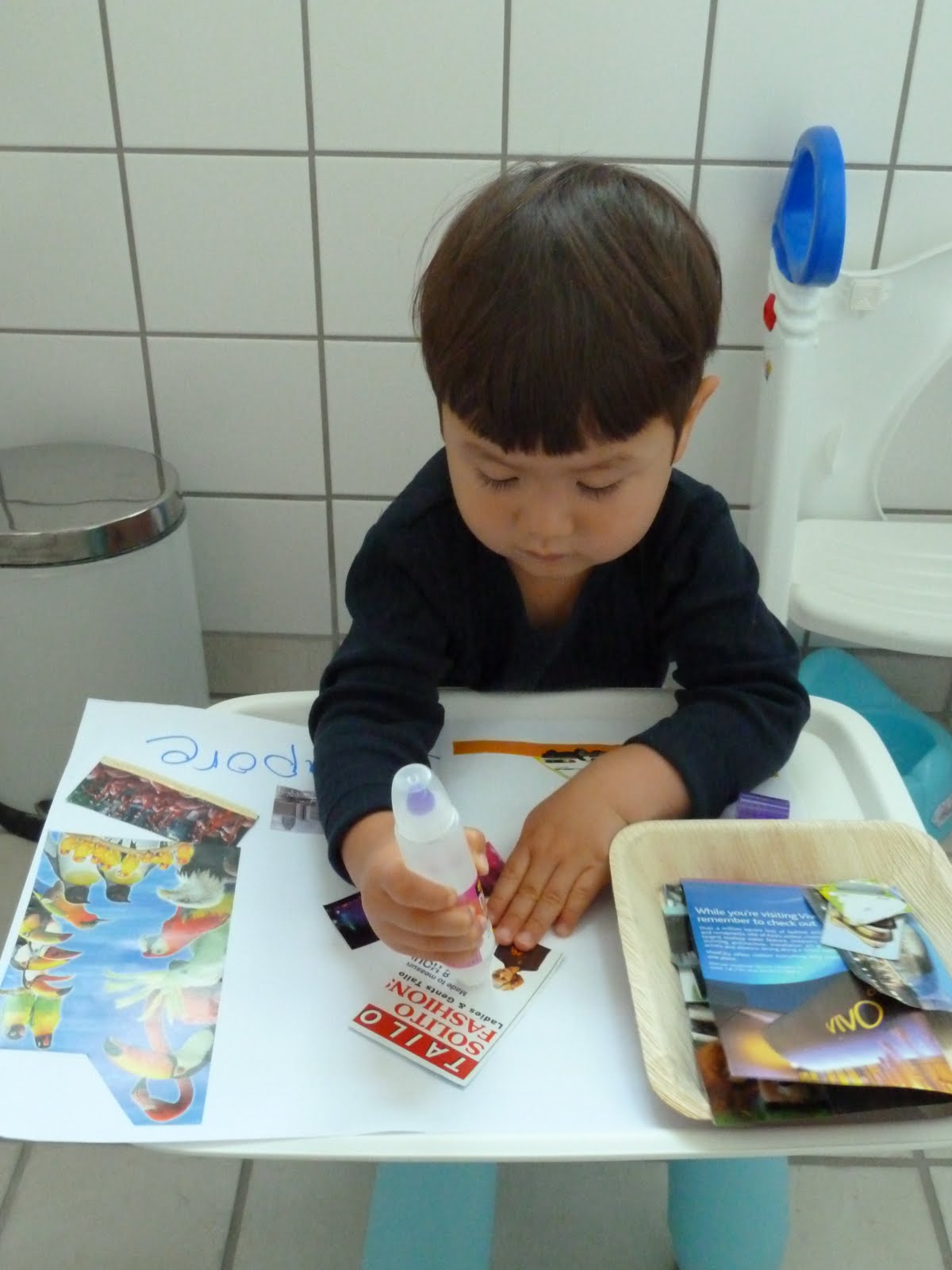 Family FECS: Montessori Activity: Pasting Pictures of Singapore with Glue