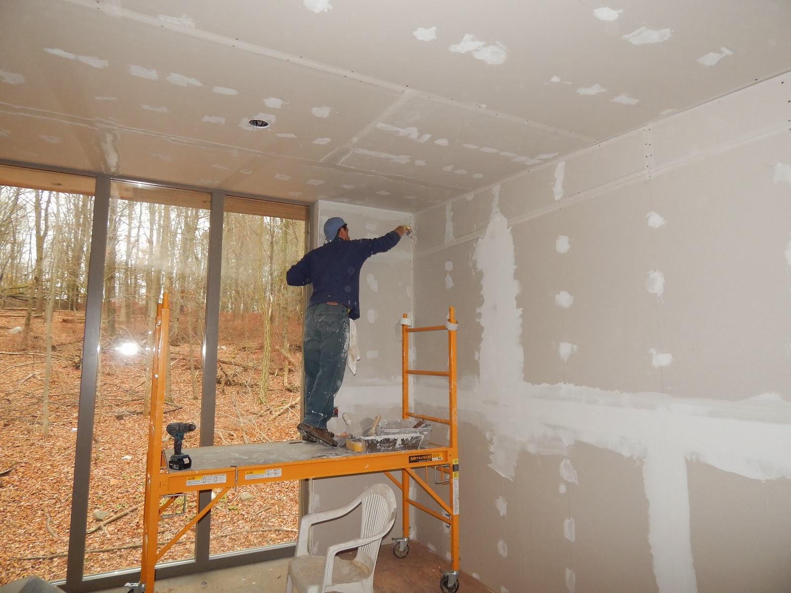The Lake House Project: Sheetrocking the Ceiling and Plasterwork