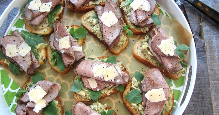 Filet of Beef Crostini w/ Artichoke Pesto & Parmesan Curls
