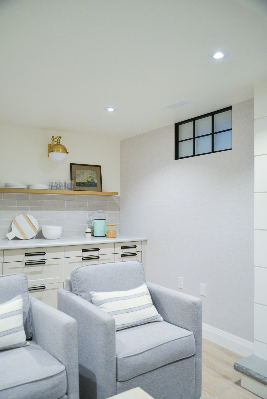 A Bright and Neutral Basement One Year Later - Rambling Renovators