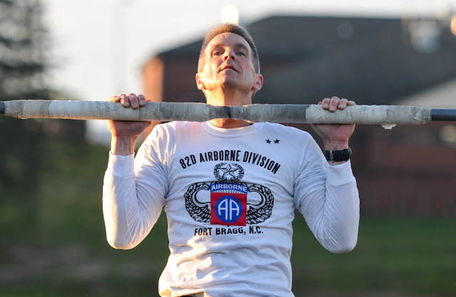 SNAFU!: Maj. Gen. Richard Clarke performs a pull-up ... pic by Staff ...