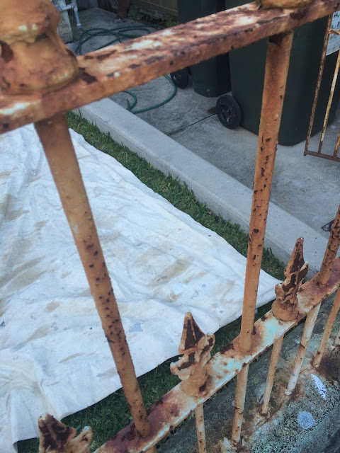 Exterior - Repainting rusted iron fence..