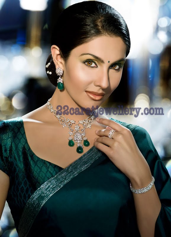 Models in Diamond Necklace Sets with Emeralds at Jewellery Event ...