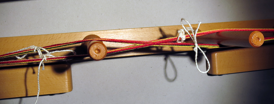 Durham Weaver: Making a warp and threading the 9 pattern slot heddle.